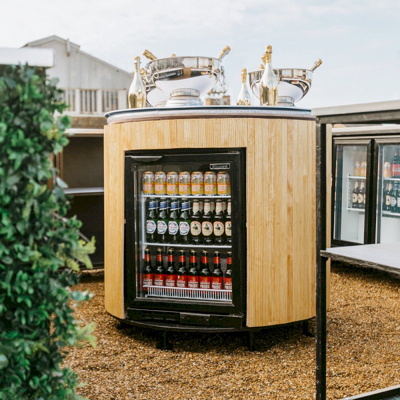 Circular Reeded Back Bar With Two Single Fridges